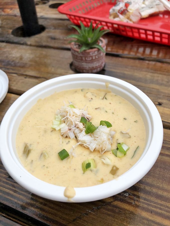 Creamy stone crab chowder that makes you question every other soup you've ever committed to memory. Those floating scallions aren't garnish—they're punctuation.