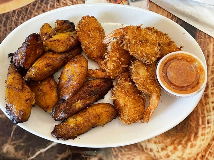 Golden coconut shrimp and caramelized plantains—a tropical alliance so perfect it should have its own diplomatic relations.
