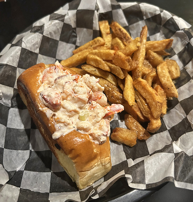 This isn't just a sandwich—it's a seafood celebration on a bun. The lobster roll comes with perfectly golden fries that demand to be savored one by one.