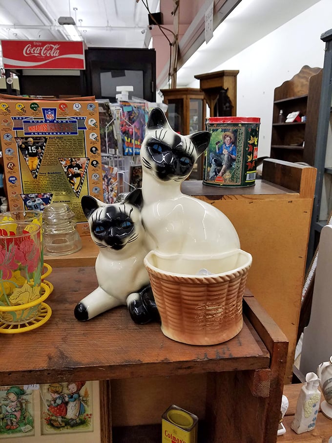 These ceramic felines aren't just decorative—they're judging your other purchases with those knowing blue eyes. Vintage kitsch at its most charming.