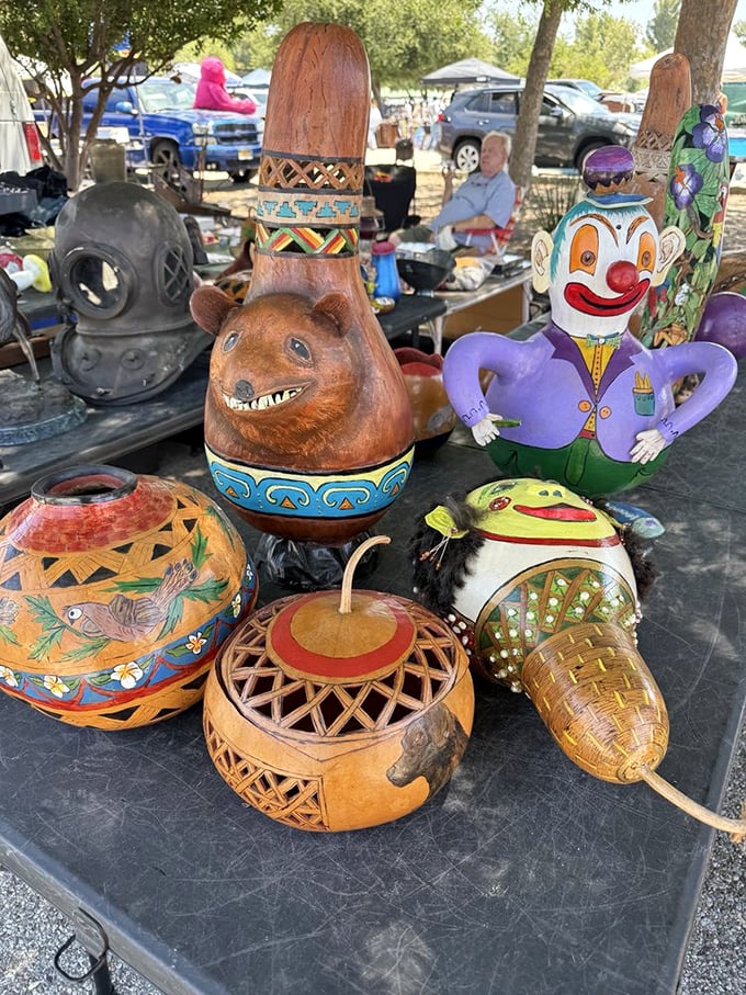 Whimsical folk art creatures stand guard over handcrafted gourds, like characters from a Tim Burton fever dream gone delightfully right.