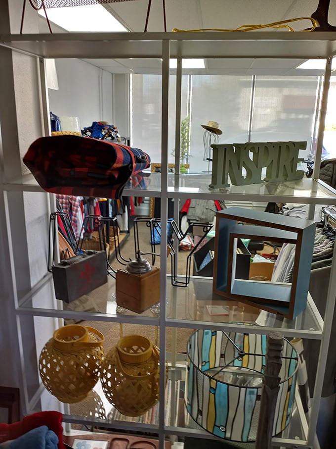 Every shelf tells a story. That "INSPIRE" sign isn't just decor—it's the thrift store's silent mission statement for shoppers and their homes alike.