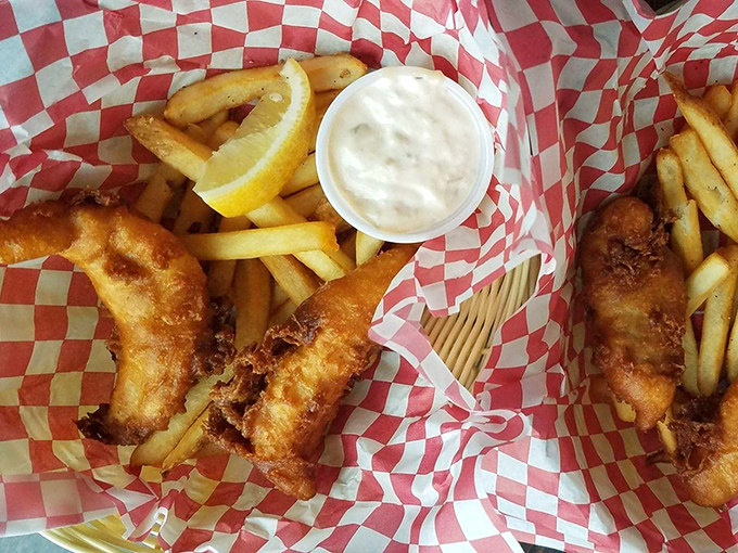 Golden-battered fish that shatters with each bite, nestled alongside crispy fries. That little cup of tartar sauce is about to have its moment.