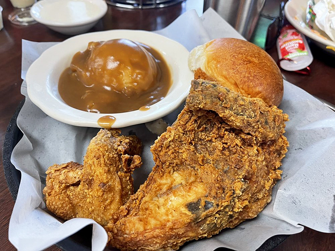 Golden-brown perfection that makes Colonel Sanders look like an amateur. This fried chicken doesn't just set the bar—it is the bar for crispy, juicy poultry perfection.