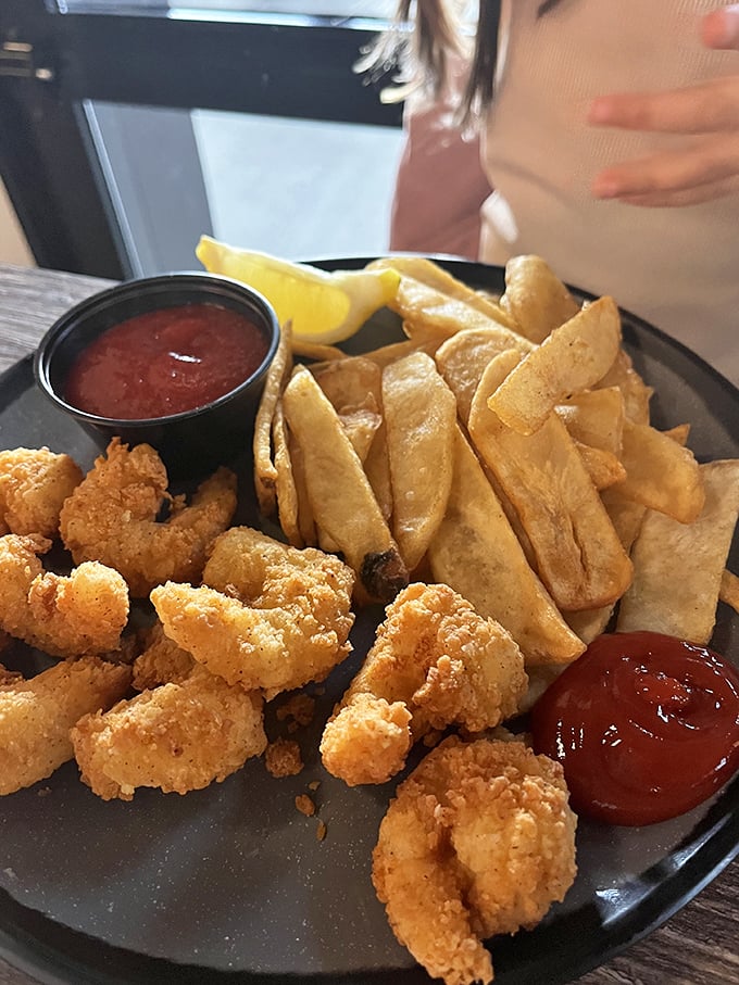 Golden-fried shrimp that crunch like nature's perfect potato chip. Paired with those hand-cut fries, it's the kind of plate that makes conversation stop and eyes close in appreciation.