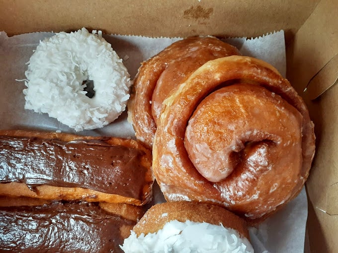 These aren't your gas station donuts; each glazed beauty represents decades of perfected technique.