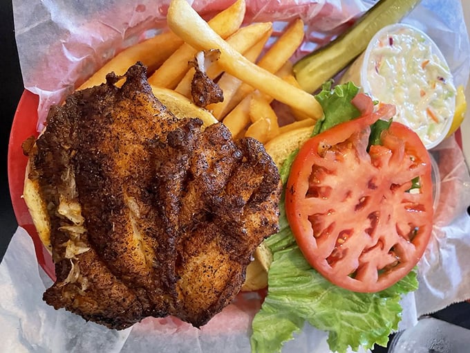 The blackened grouper sandwich—where spice meets fish in a romance so perfect, you'll want to write sonnets about it. Those fries aren't bad company either.