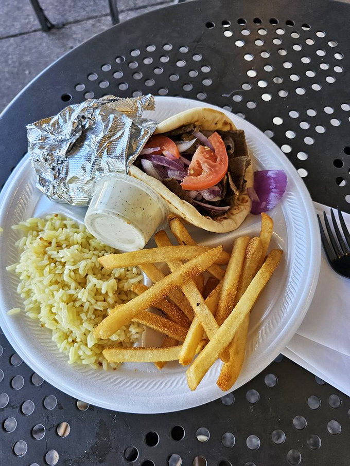 This gyro isn't just a sandwich—it's a perfect trilogy of seasoned meat, fluffy rice, and crispy fries that makes fast food chains weep with inadequacy.