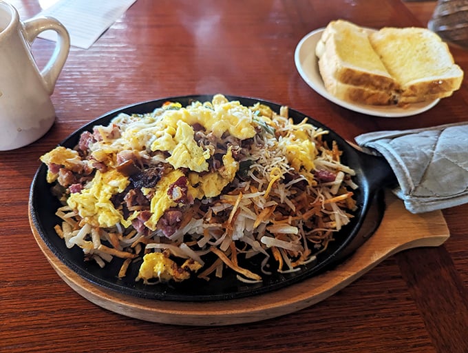 Behold the Dutch Scramble – where hash browns, eggs, and breakfast meats unite in a skillet symphony that makes morning people out of night owls.