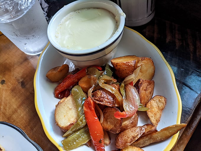 These aren't just home fries—they're potato perfection. Crispy exteriors, pillowy interiors, and those caramelized peppers and onions? Breakfast nirvana.