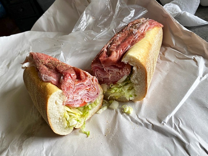 Behold the architectural marvel that is Lorenzo's Italian hoagie. Those perfectly layered meats aren't just ingredients—they're a commitment to sandwich perfection.