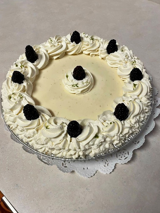 A key lime pie crowned with blackberries and whipped cream—Florida sunshine transformed into something you can actually enjoy in August.