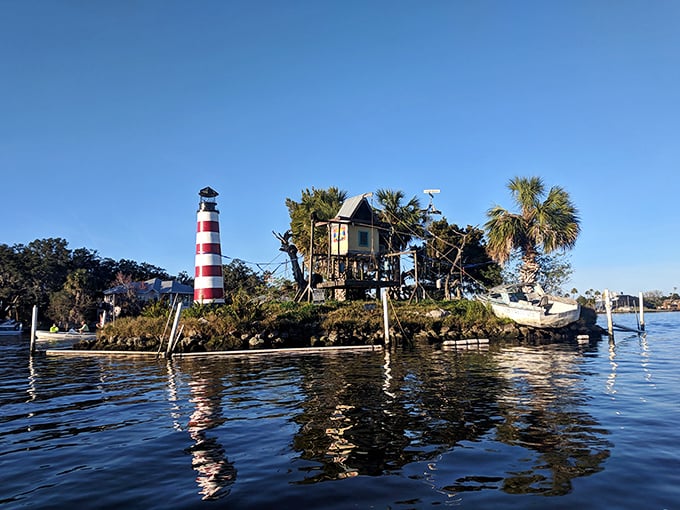 This whimsical mini-lighthouse island looks like it was dreamed up by a retired pirate with a flair for home decorating and a fondness for palm trees.