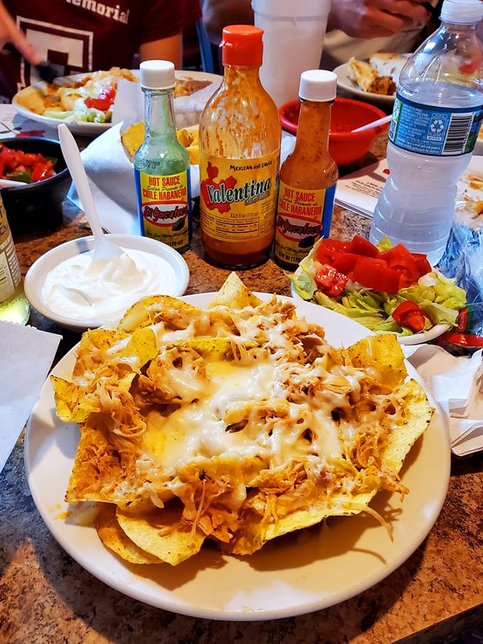 Nachos that require a structural engineer's approval—layers of melted cheese, seasoned chicken, and all the fixings create the Taj Mahal of Tex-Mex architecture.