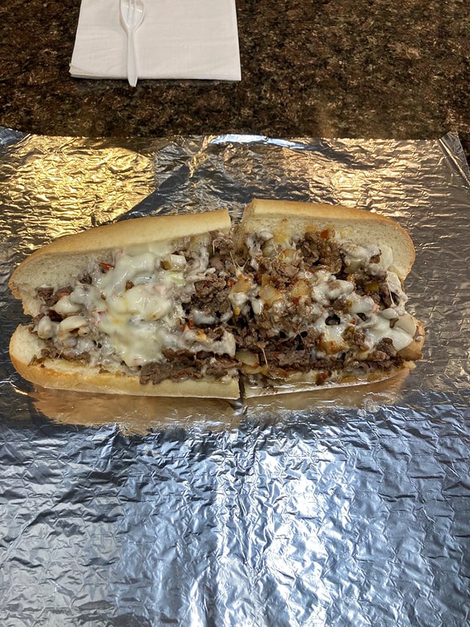 Behold the holy grail of Philadelphia cuisine—thinly sliced beef and molten cheese embraced by a perfect roll. Poetry in sandwich form.
