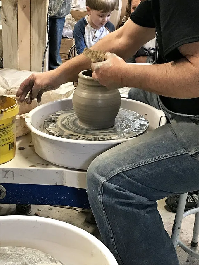 Pottery in Progress: Hands shape clay into possibility while a young observer learns that some of life's most satisfying creations happen without a charging port or Wi-Fi.