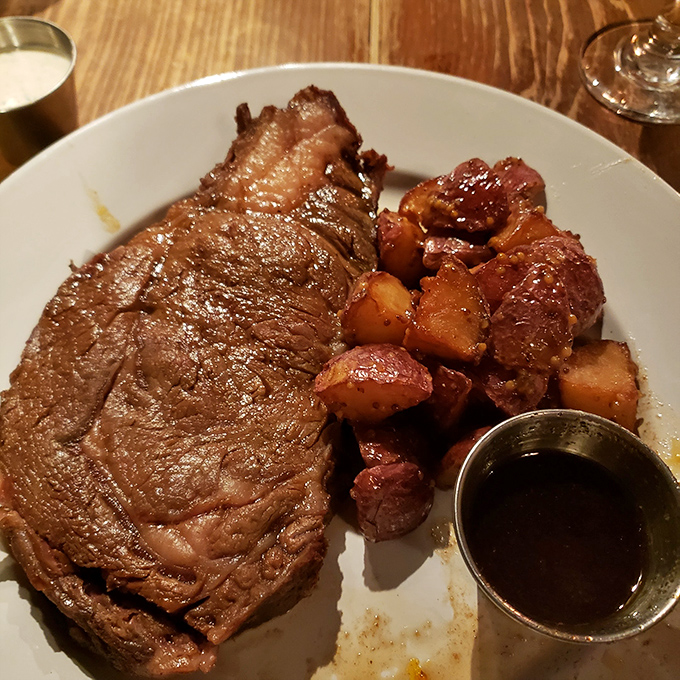 Behold the star of the show: prime rib so perfectly executed it makes vegetarians question their life choices. That au jus cup isn't nearly big enough.
