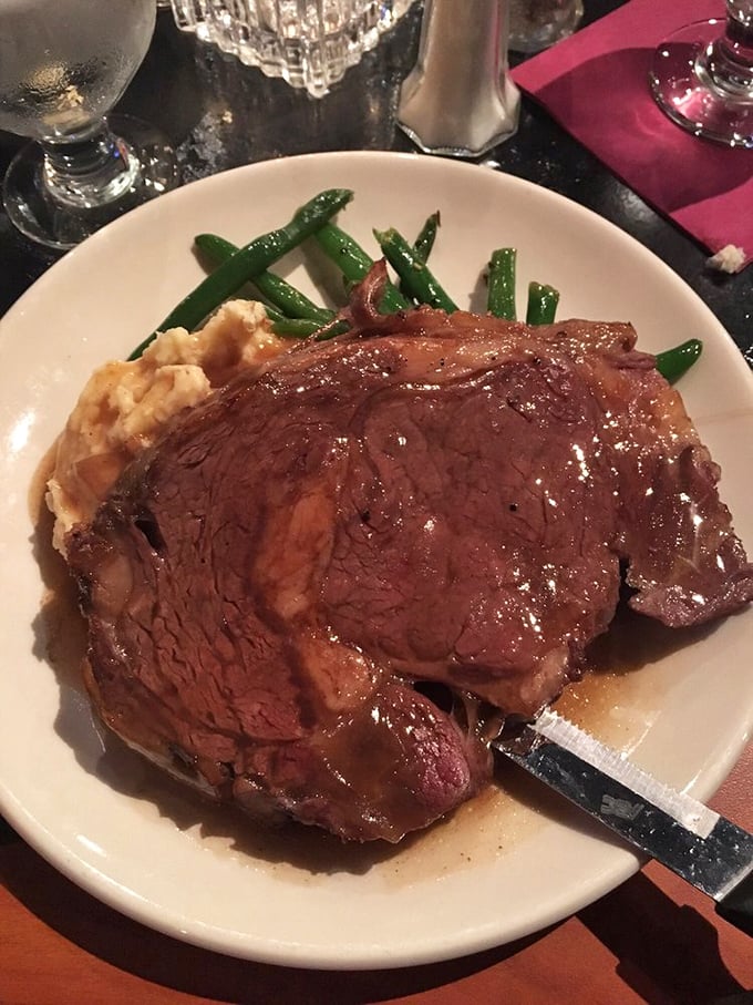 Behold the star of the show—prime rib so perfectly cooked it makes you wonder if you've been eating meat wrong your entire life.