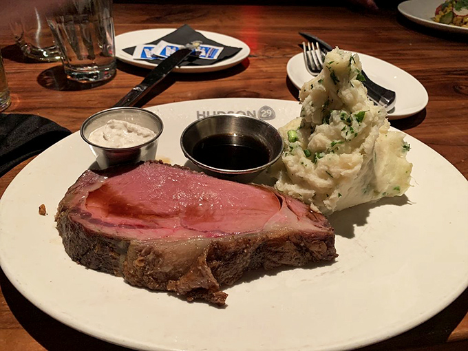 The star of the show: prime rib cooked to that perfect shade of pink, with mashed potatoes standing tall like a delicious snow-capped mountain. Meat dreams are made of this.