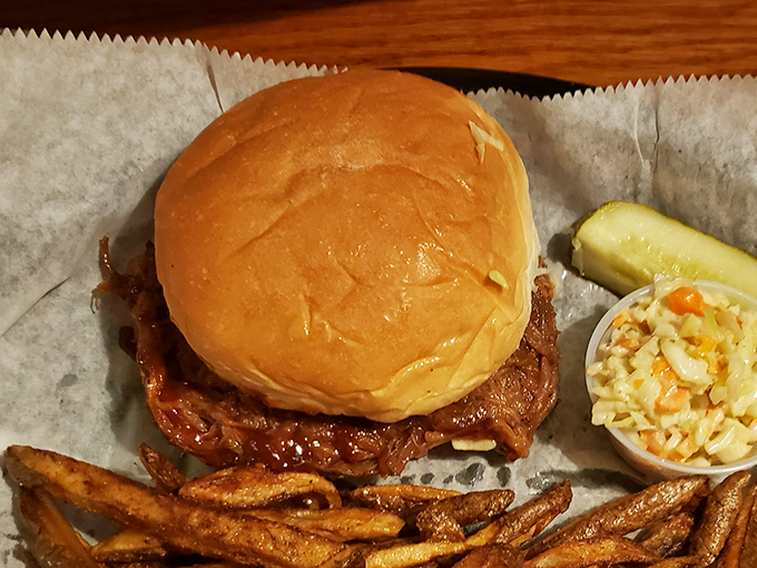 Simple perfection on a bun. This pulled pork sandwich doesn't need fancy tricks—just slow-cooked meat, tangy sauce, and the confidence to let quality ingredients speak for themselves.
