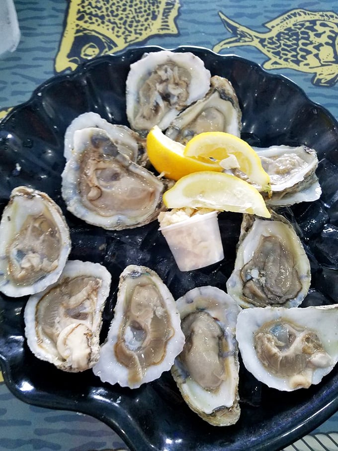 These oysters aren't just served; they're presented – a briny celebration of the sea with bright lemon wedges standing by for duty.