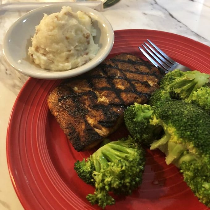 This blackened salmon isn't just cooked—it's performed. Perfectly charred exterior, flaky interior, and sides that don't know they're supposed to be supporting actors.