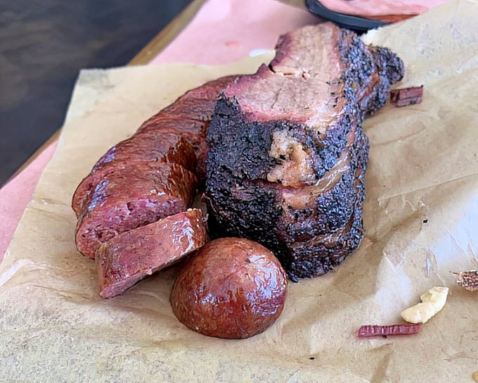 Brisket with that coveted smoke ring and sausage that snaps when you bite it—this plate is the barbecue equivalent of winning the lottery.
