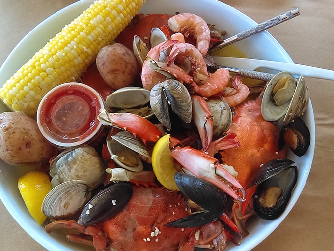 Behold the seafood pot – a glorious mess of clams, mussels, shrimp, and crab that demands your full attention.