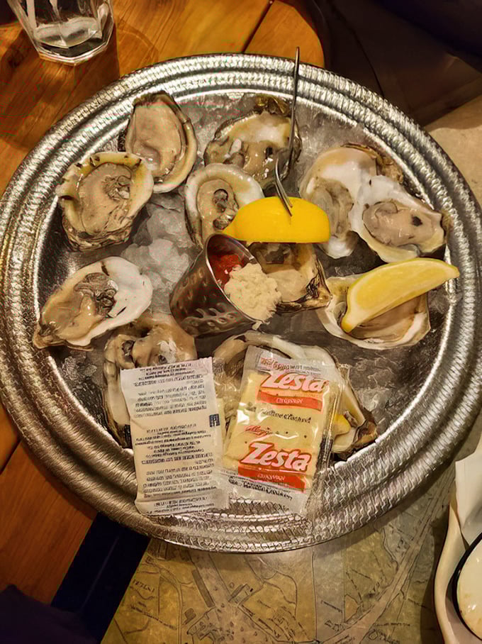 Fresh oysters on ice with lemon wedges and cocktail sauce—nature's perfect appetizer and the ocean's version of "here's a little something to tide you over."