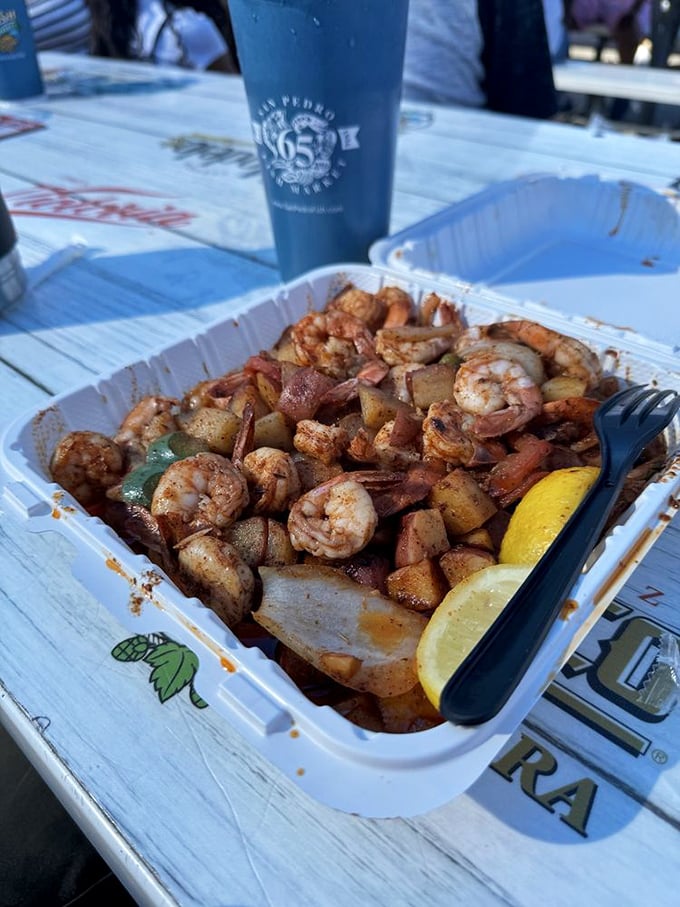 Shrimp and potatoes sizzling in spices—a tray of pure joy. This isn't just lunch; it's edible sunshine with a side of lemon.