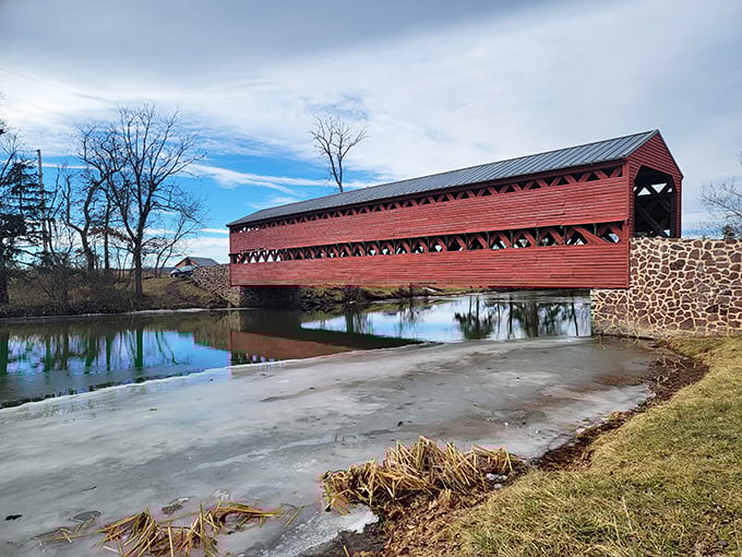 The bridge's classic silhouette creates a postcard-worthy scene against blue Pennsylvania skies. That rusty red color isn't just pretty—it's historically accurate craftsmanship.