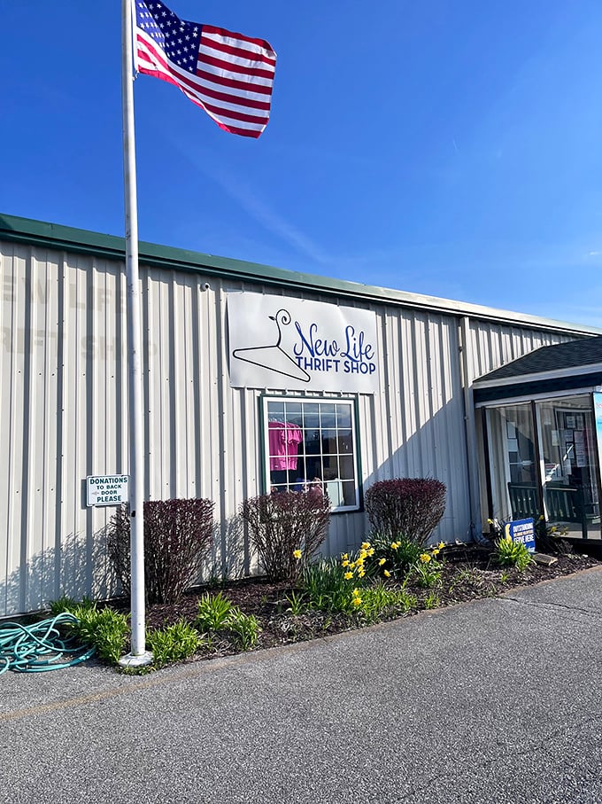 Standing tall under Delaware's blue skies, this thrift shop flies the American flag proudly—patriotism and good deals under one roof.