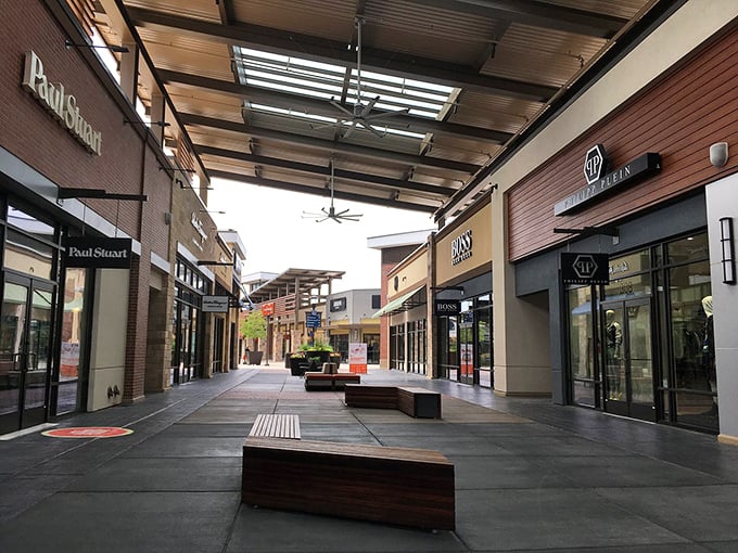 Premium brands line this covered walkway where comfortable benches await shopping partners who've reached their retail endurance limit.