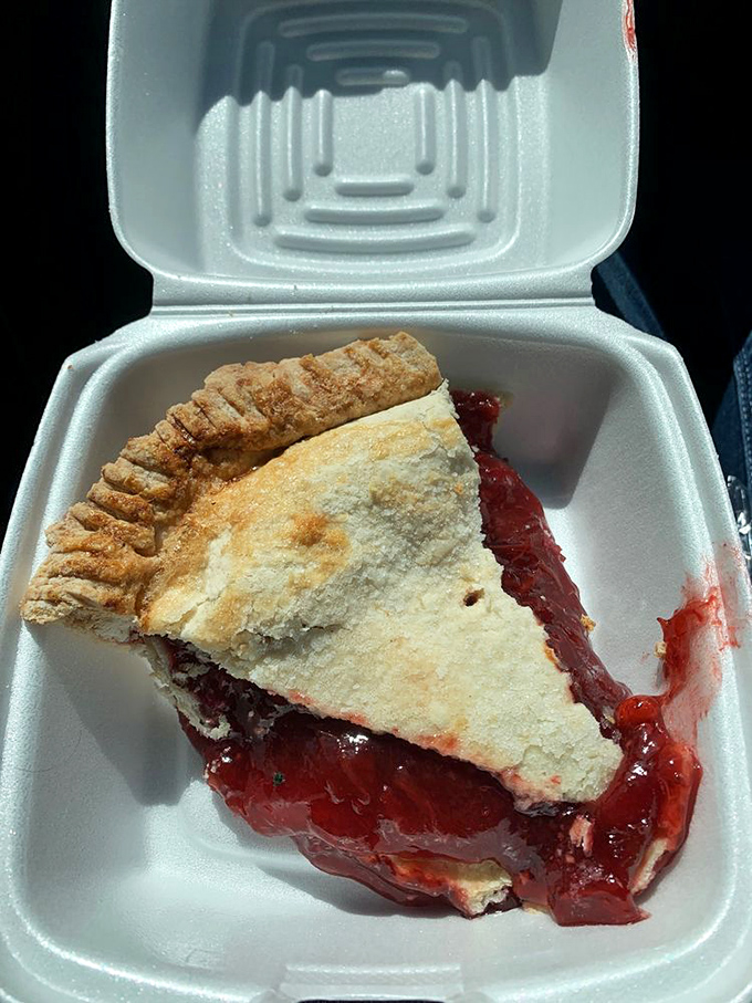 This isn't just strawberry pie – it's summer captured in a flaky crust, the kind of dessert that makes you contemplate ordering a second slice before finishing the first.