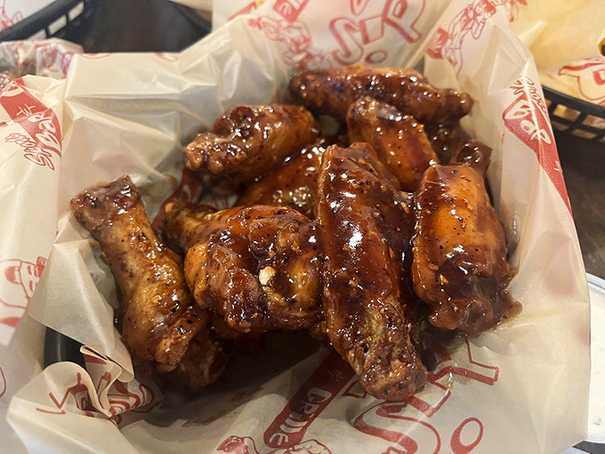 These wings aren't just cooked—they're transformed. Glistening with sauce that promises to leave memories on your taste buds and napkins.