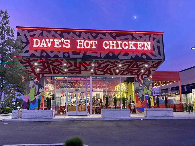 Dave's Hot Chicken lights up the night with its wild patterns and colors – a Nashville heat wave in Salem's food scene.