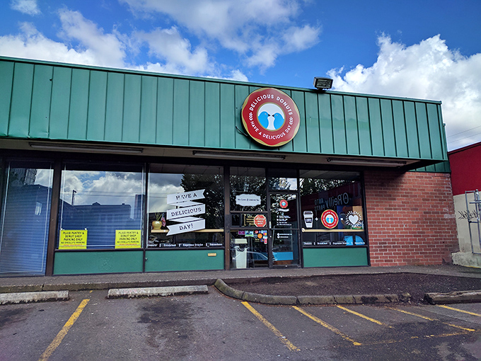Delicious Donuts keeps it real with that straightforward green storefront. No gimmicks needed when your maple bars speak for themselves.