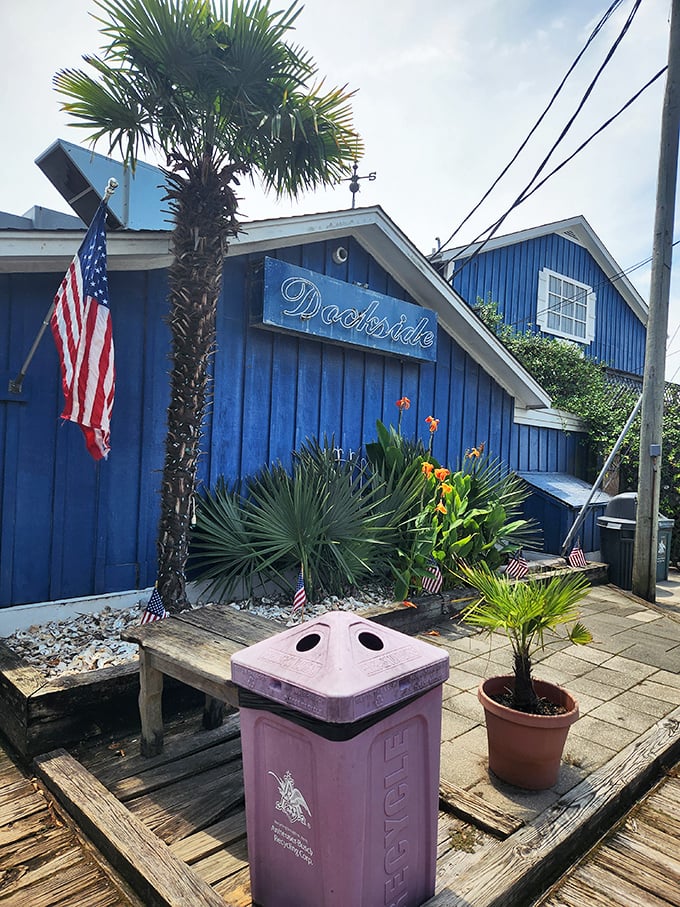 Dockside's brilliant blue exterior is as bold as their seafood flavors. That American flag isn't just patriotic—it's waving you in!
