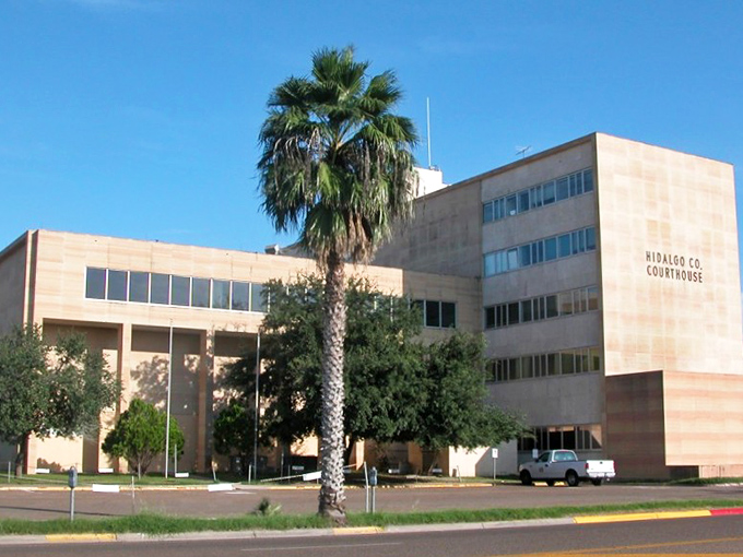 Edinburg's Hidalgo County Courthouse—where government business happens with just enough sandstone gravitas to make you feel important.
