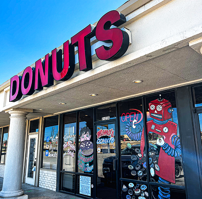 That robot isn't just decoration—he's guarding some of the most creative donuts this side of the Red River.