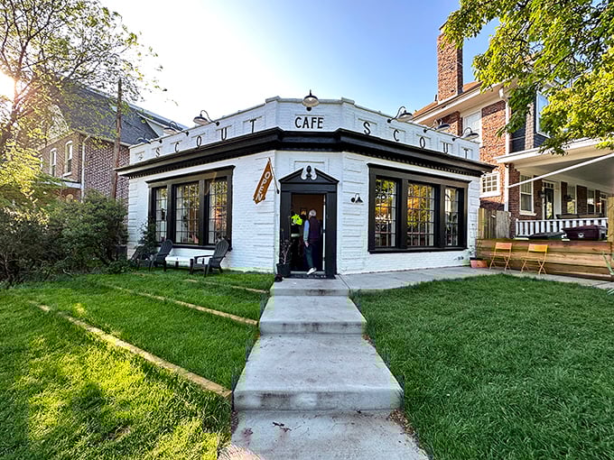 Scout Cafe's pristine white building stands like a friendly neighborhood beacon, promising good coffee and even better conversations.