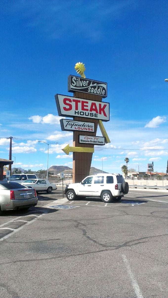 That classic roadside sign is like a beacon to beef lovers – Silver Saddle's vintage marquee has been guiding hungry travelers for generations.