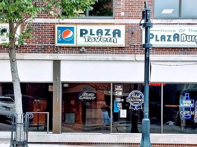 The Plaza Tavern's modest storefront hides Madison's worst-kept secret—a burger with sauce so legendary, it's probably discussed in UW philosophy classes.