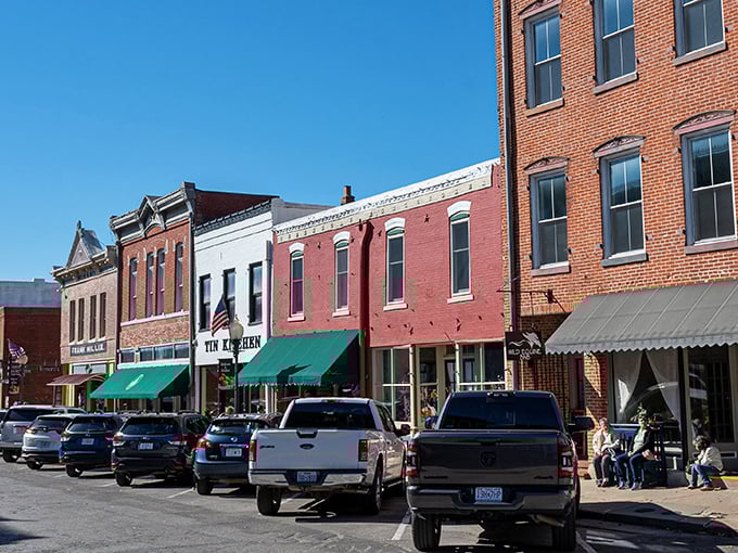 Brick storefronts line Main Street like a movie set waiting for action. The green awnings add pops of color to this perfectly preserved scene.