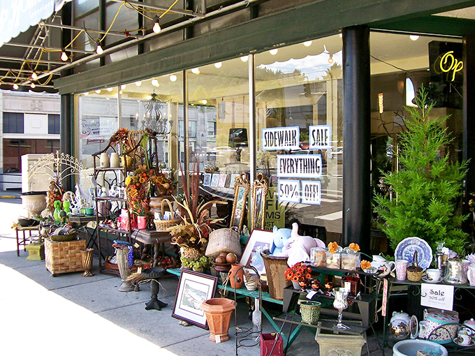 A sidewalk sale spills out with garden treasures – one person's rusty metal is another's patio masterpiece!