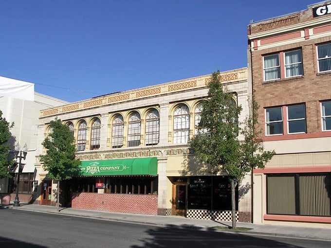 "Pizza with a side of history! That gorgeous vintage façade makes ordering a pepperoni feel like stepping back in time."