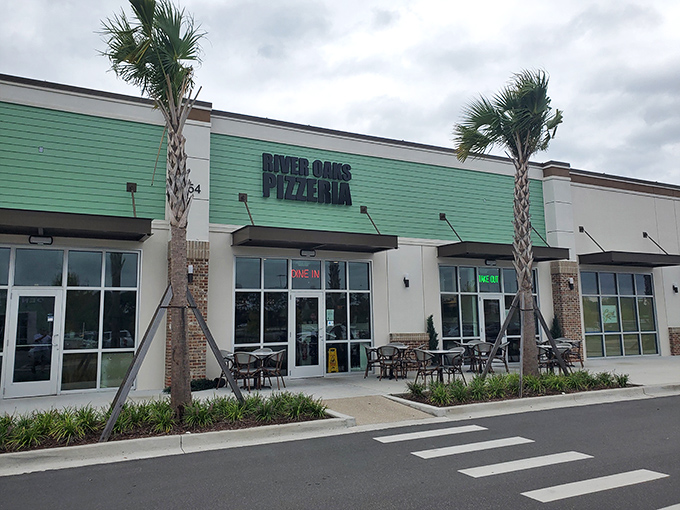 That mint-green exterior isn't just pretty—it's a signal that something fresh and different awaits inside this Myrtle Beach pizza haven.