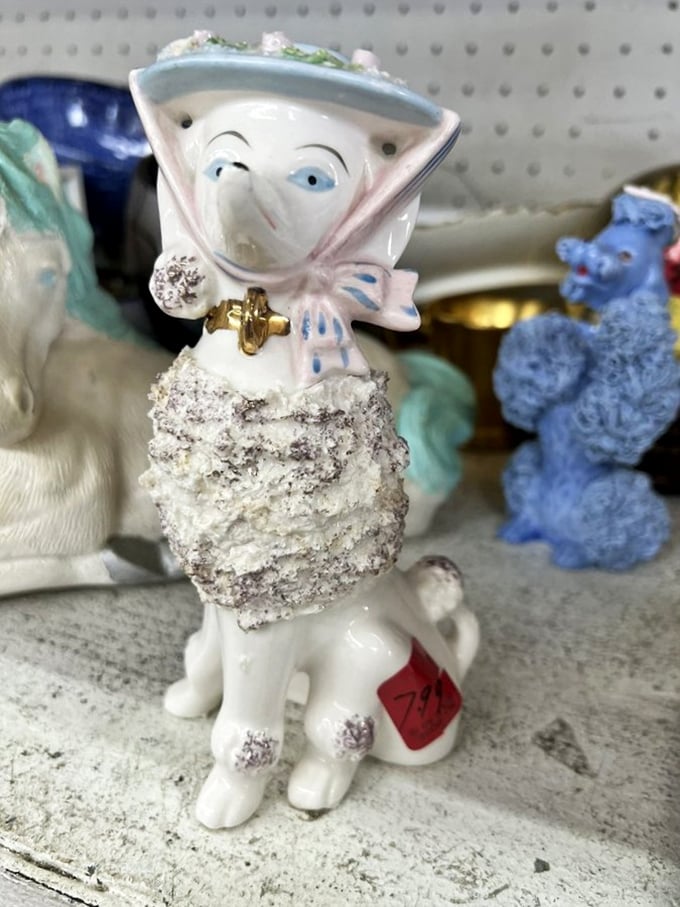 This peculiar porcelain poodle-person hybrid is exactly why thrift stores remain superior to boring retail – where else does $7 buy such conversation pieces?