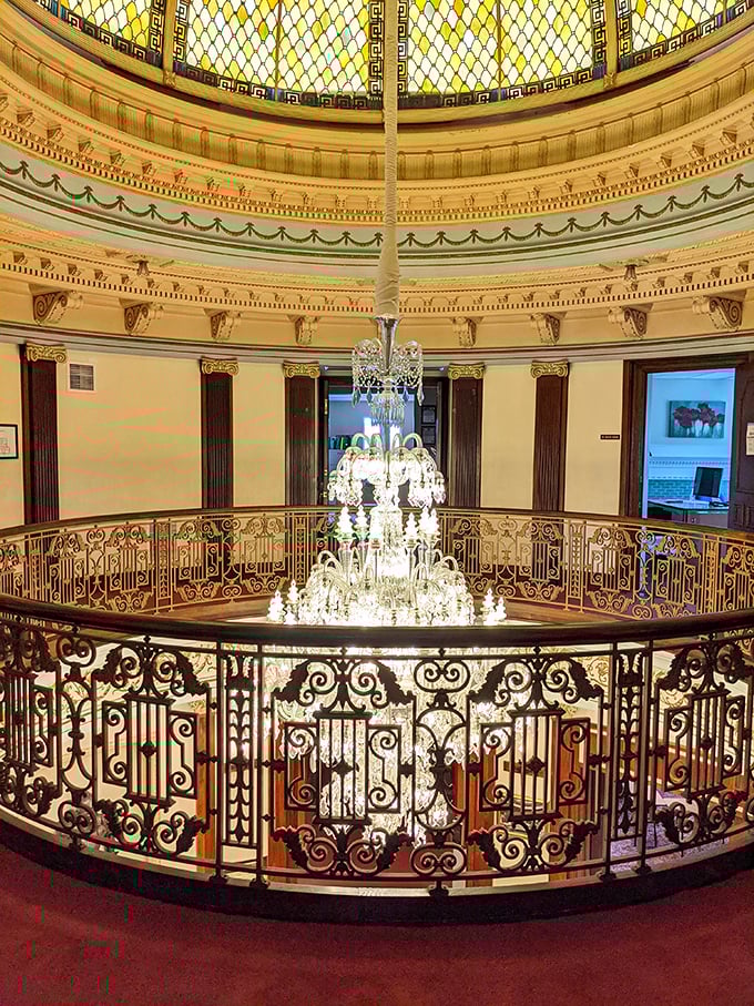 
The rotunda's stained glass dome bathes visitors in kaleidoscopic light, while the chandelier below dangles like a crystalline exclamation point to Morgan's wealth. 
