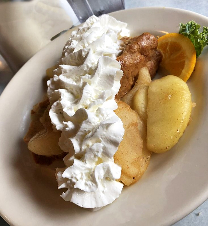 French toast that makes you question every other breakfast decision you've ever made. That mountain of whipped cream isn't just decoration—it's a lifestyle choice.